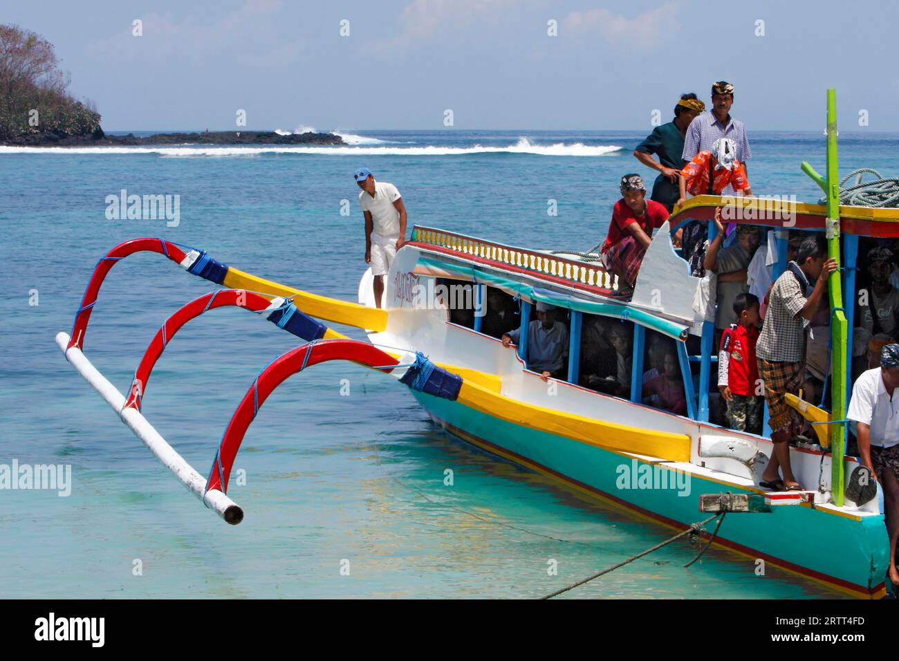 Colourful outrigger boat with passengers, Bali, Indonesia Stock Photo ...