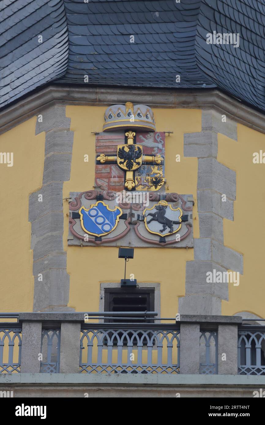 City coat of arms and parapet on the tower of St. John's Minster ...