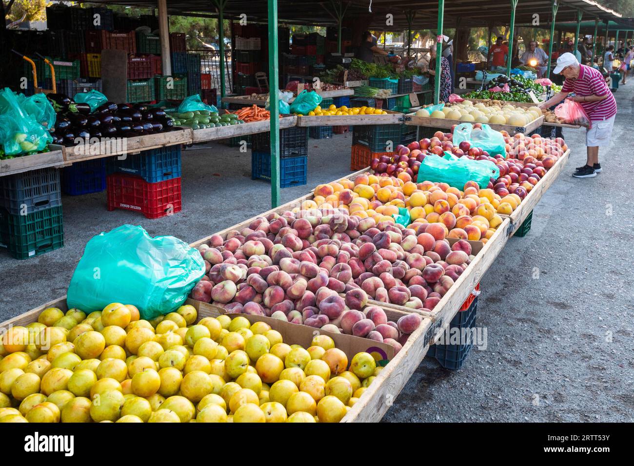 Locals buy fresh fruit and vegetables at the market in Rhodes Town in ...