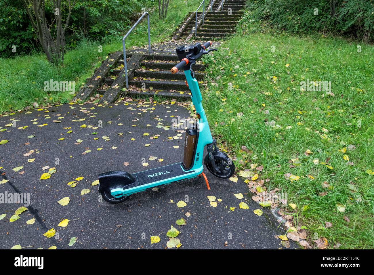 E-scooter of bike rental company TIER parked on pavement, Stuttgart ...