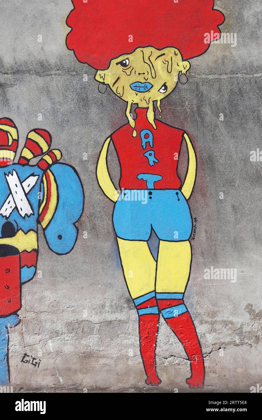 Colourful figure with surreal face, symbolising art, mural by students ...