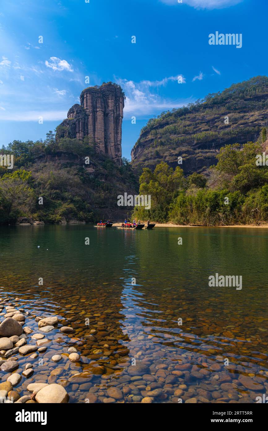 A rocky shore on the nine bend river or Jiuxi in Wuyishan or Mount wuyi ...