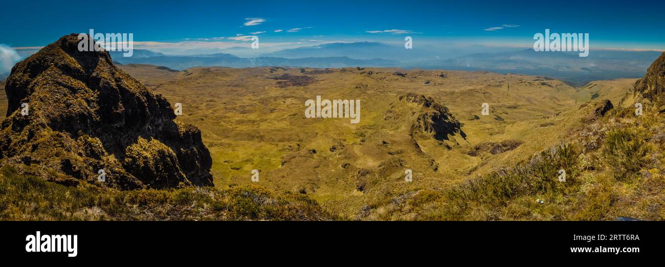 Panoramic photo of hiker sitting on ground surrounded by wild nature ...