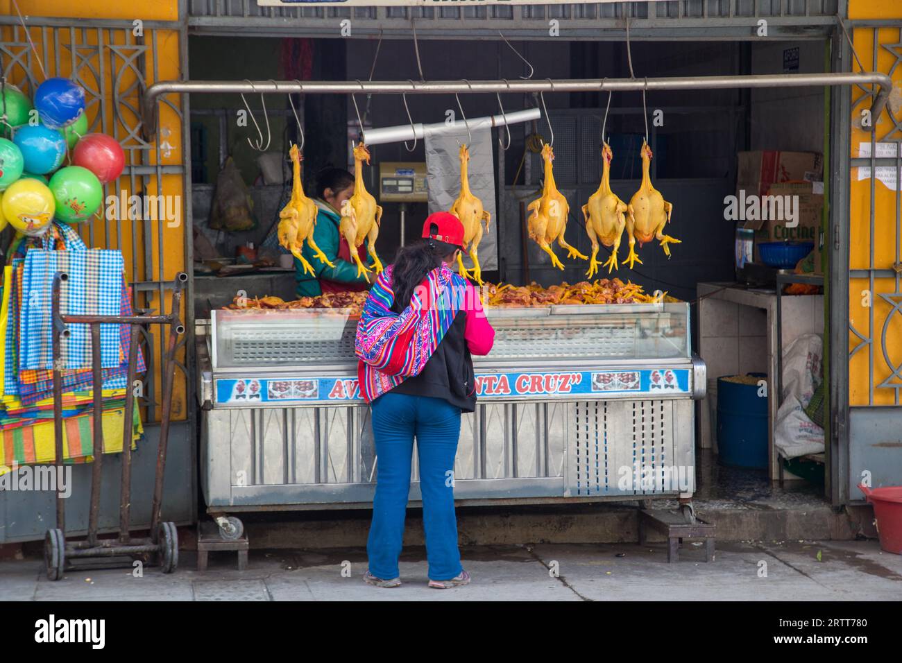 Huaraz, Peru, October 1, 2015: Customer at a chicken stall at local the ...