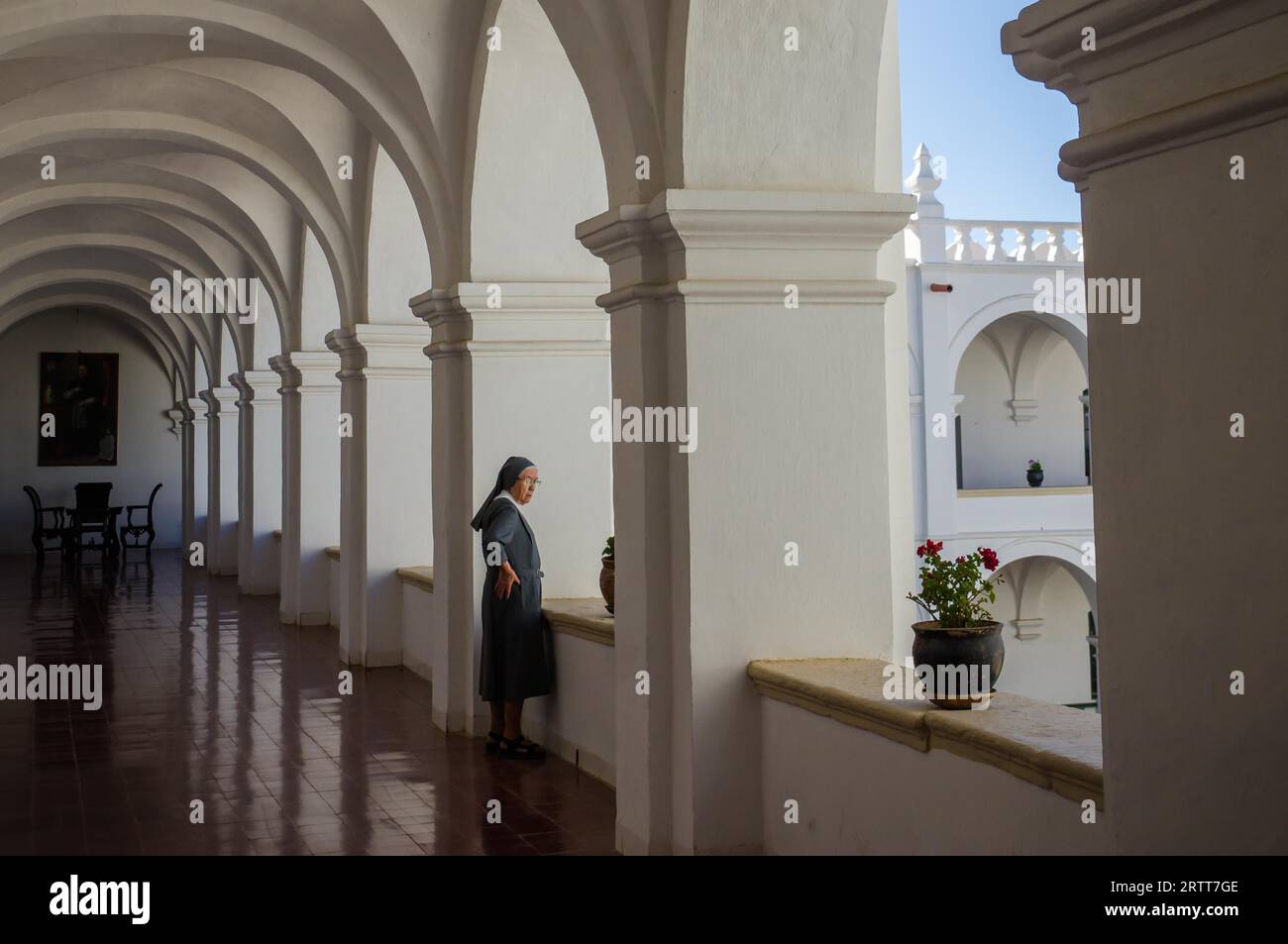Sucre, Bolivia in September 2015: A nun looks out of a window in a ...