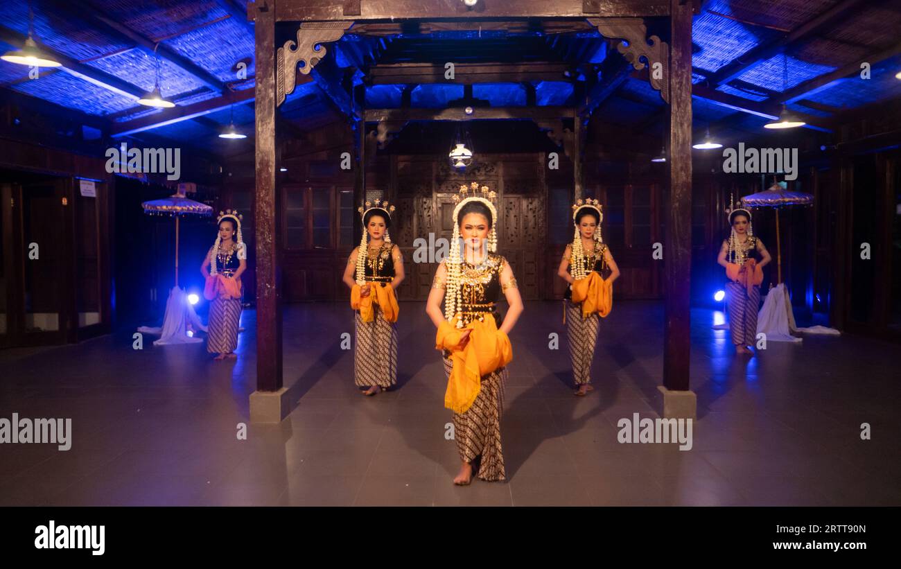 a group of Javanese dancers with their faces full of makeup and jasmine ...
