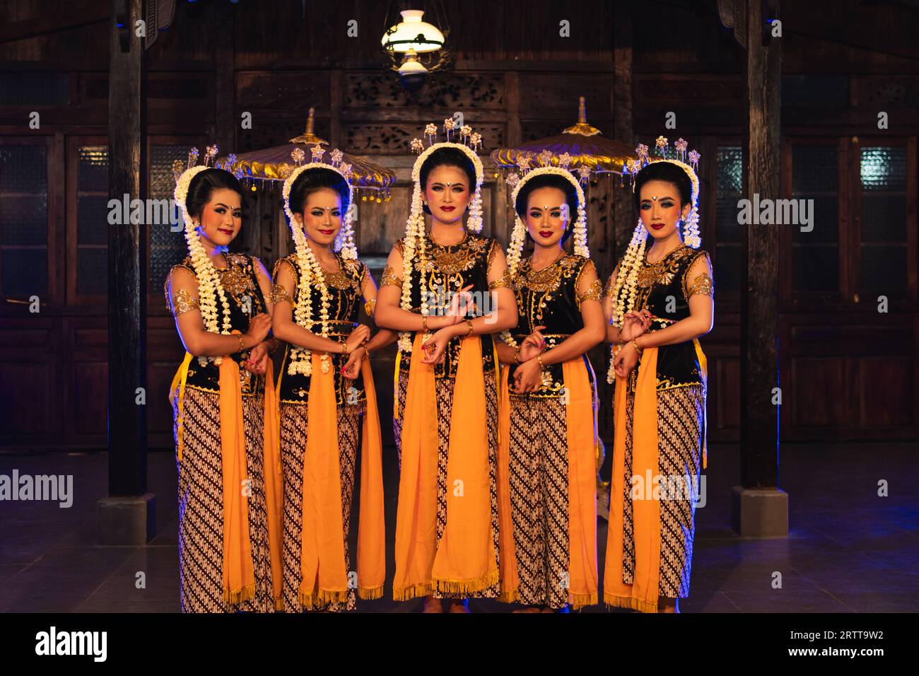a group of Javanese dancers standing with their friends while wearing ...