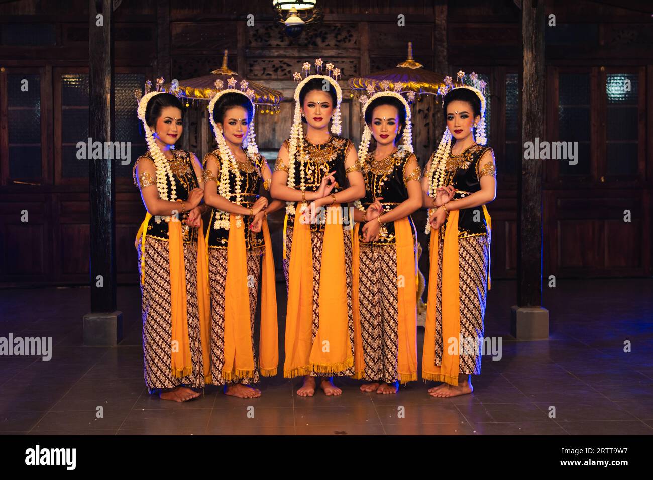 a group of Javanese dancers standing with their friends while wearing ...