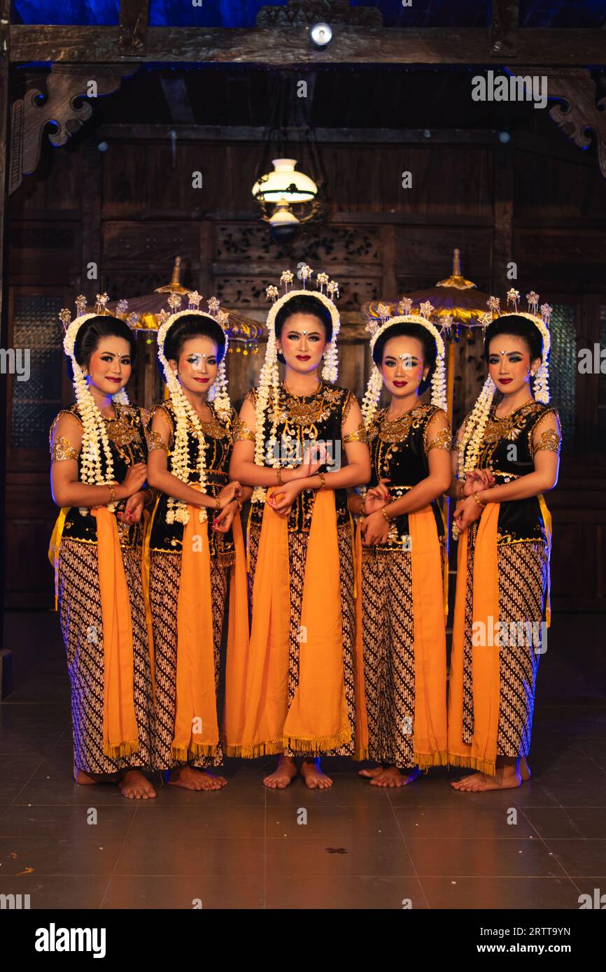 a group of Javanese dancers standing with their friends while wearing ...