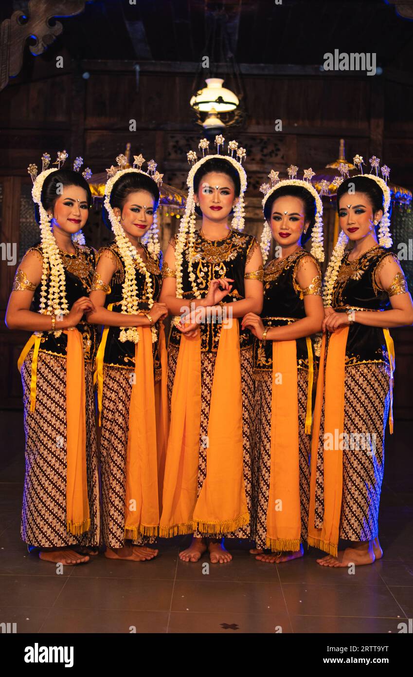 a group of Javanese dancers standing with their friends while wearing ...