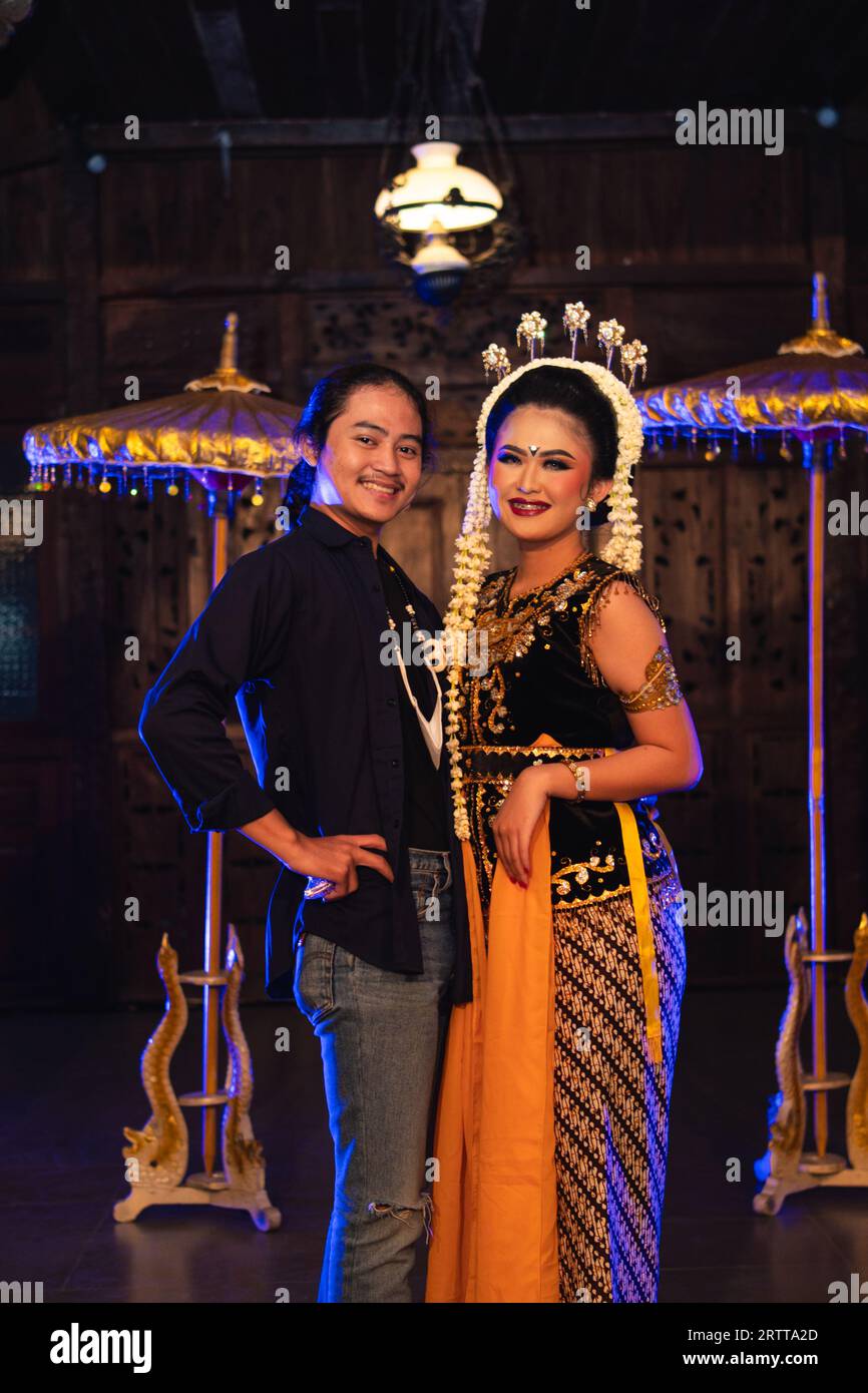 a Javanese dancer taking pictures with fans on stage at night Stock ...