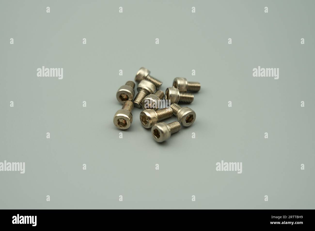 Stainless steel round head hex bolt, gray background Stock Photo - Alamy
