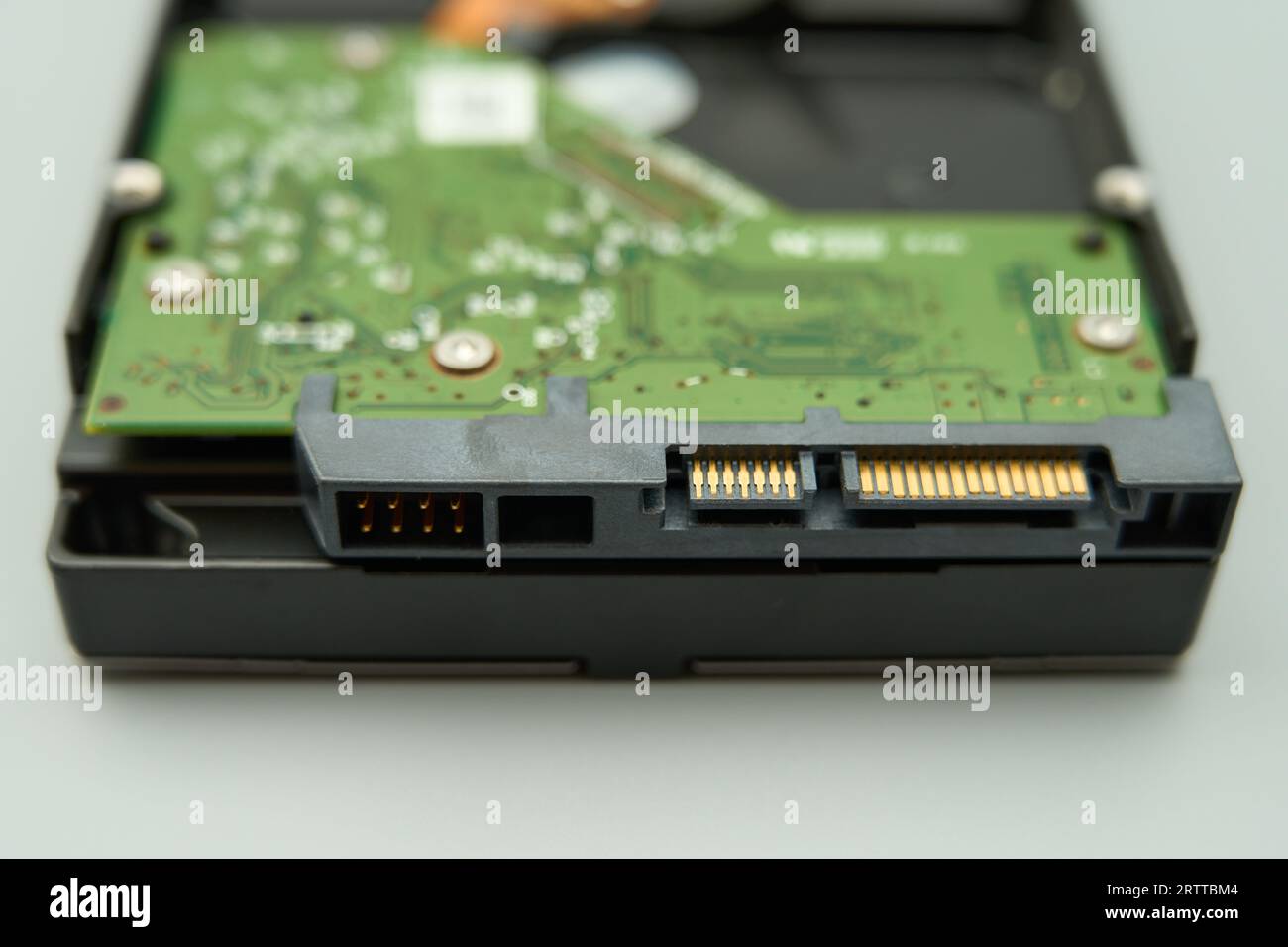 The SATA connector of a hard disk drive, gray background Stock Photo ...