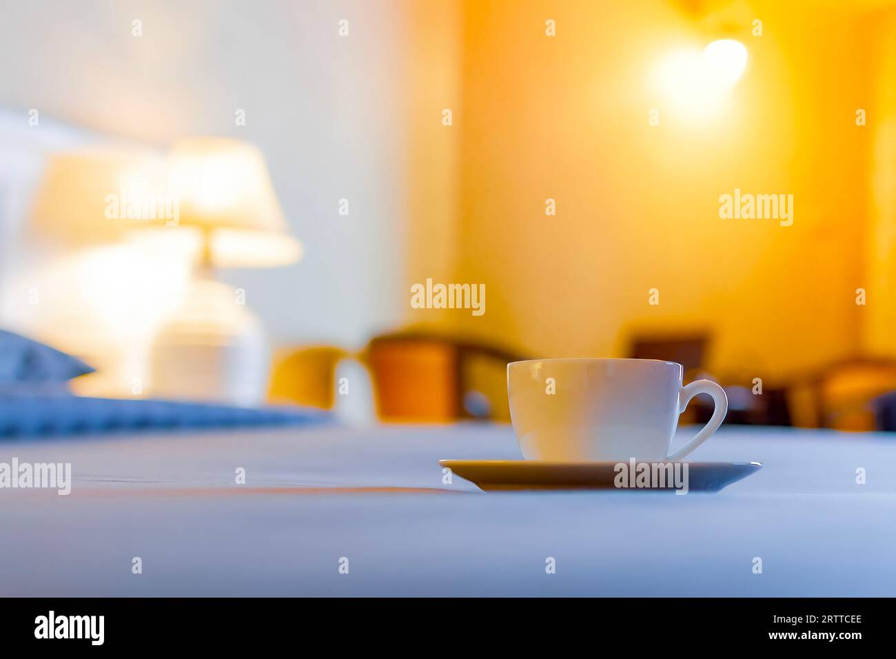 Start your day right with a warm cup of coffee in a cozy bed, basking in the gentle glow of a ...