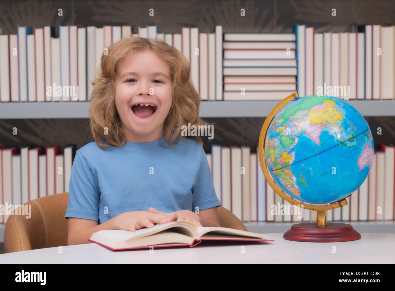 School child 7-8 years old with book go back to school. Little student ...