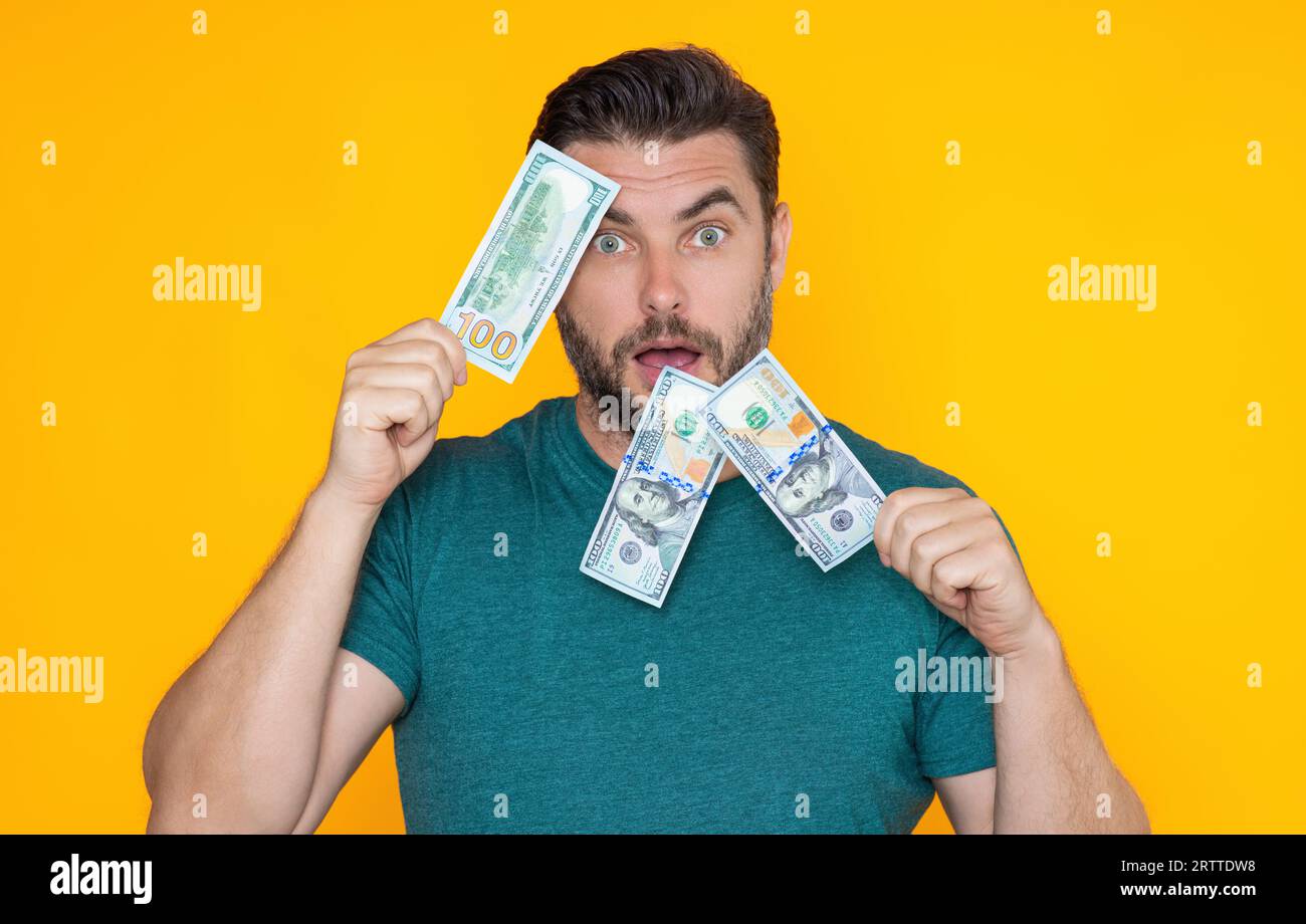 Money cash, dollar banknotes concept. Portrait of man holding bunch of ...