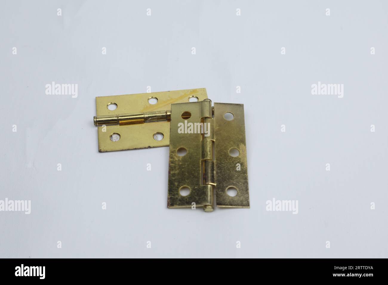golden door hinge isolated on a white background Stock Photo - Alamy