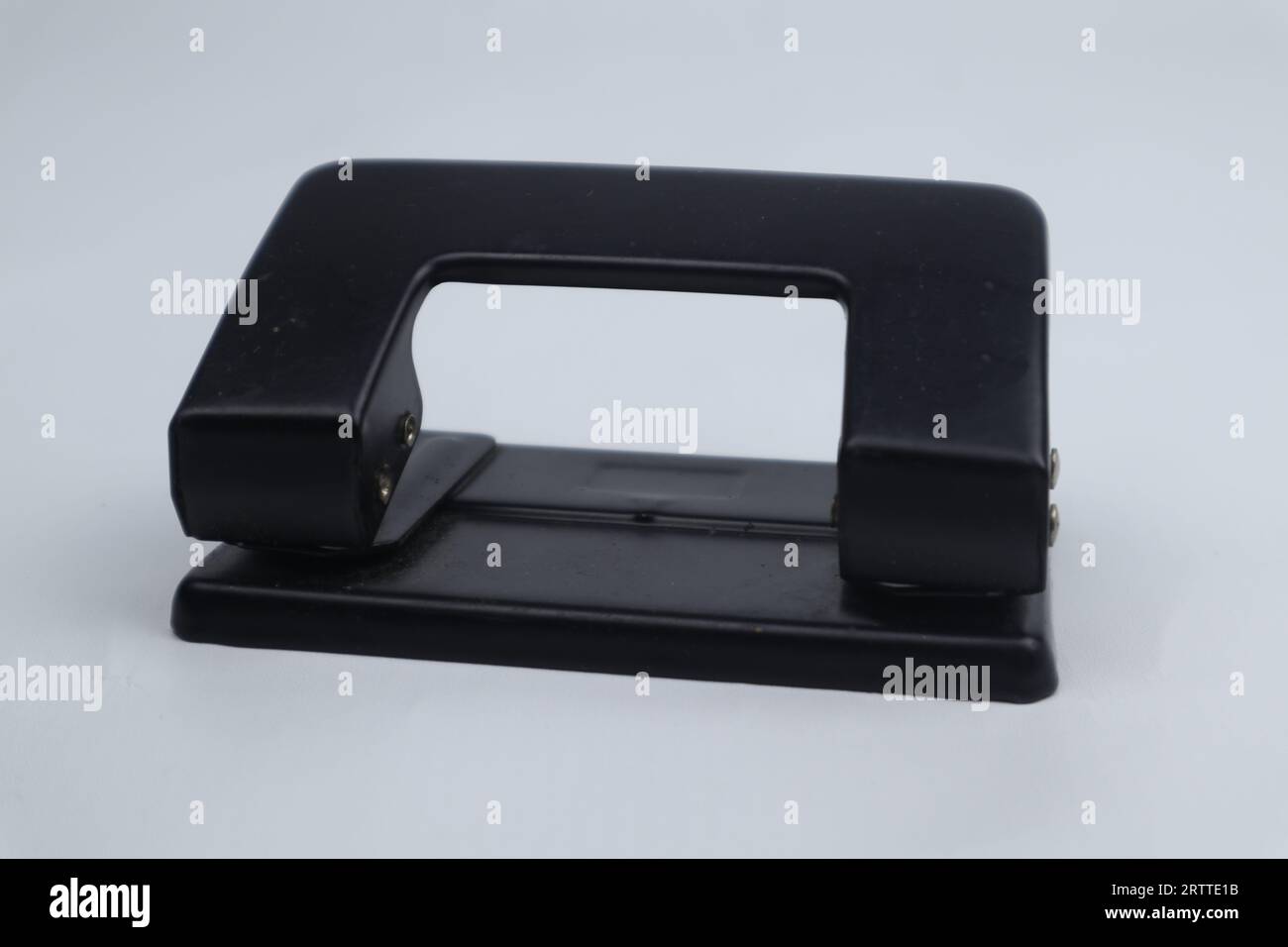 Office paper perforator isolated on white background Stock Photo - Alamy