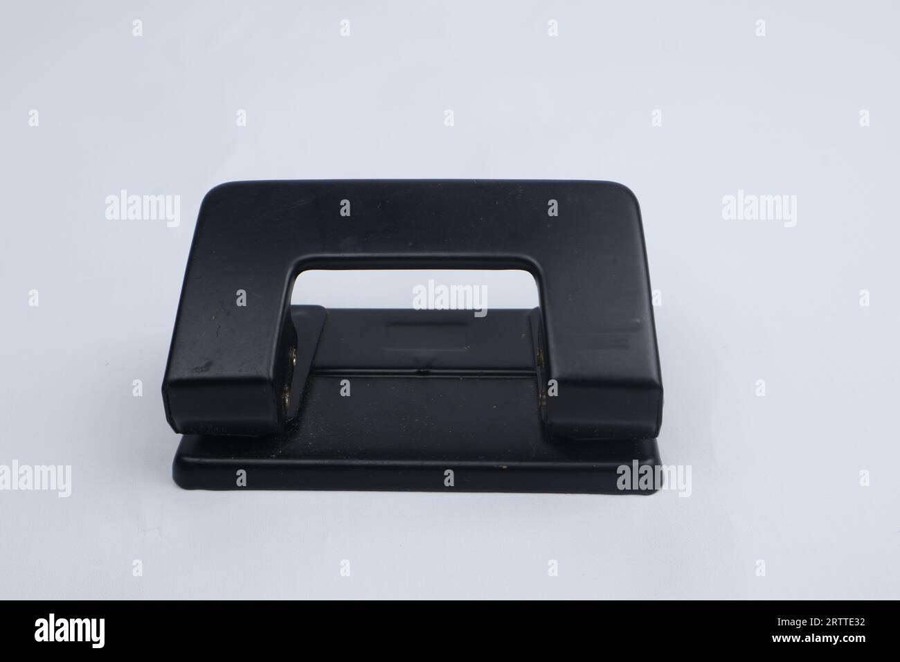 Office paper perforator isolated on white background Stock Photo - Alamy