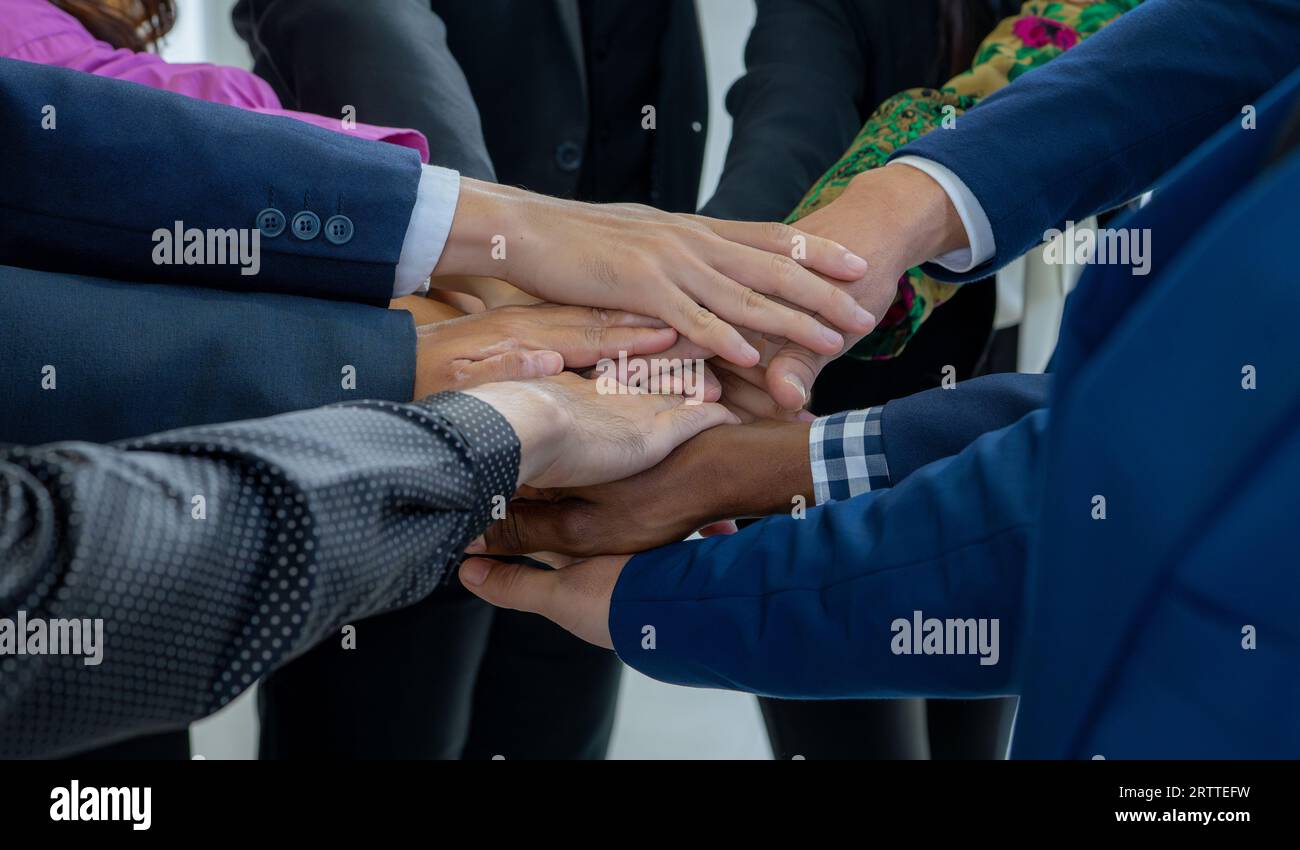Team, teamwork, and unity concept. Diverse team putting hands together. Group of diverse ...