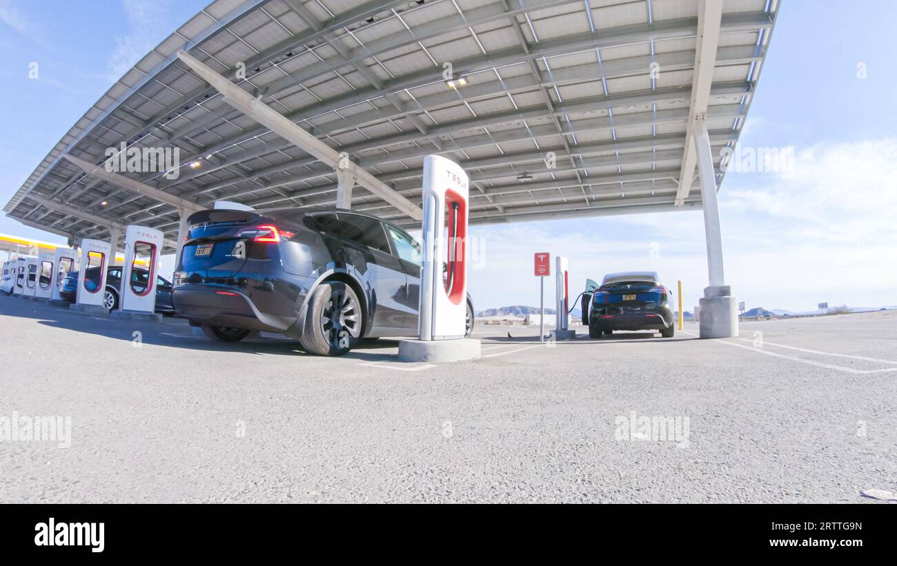 Daytime Tesla Charging: Supercharging Station Power-Up Stock Photo - Alamy