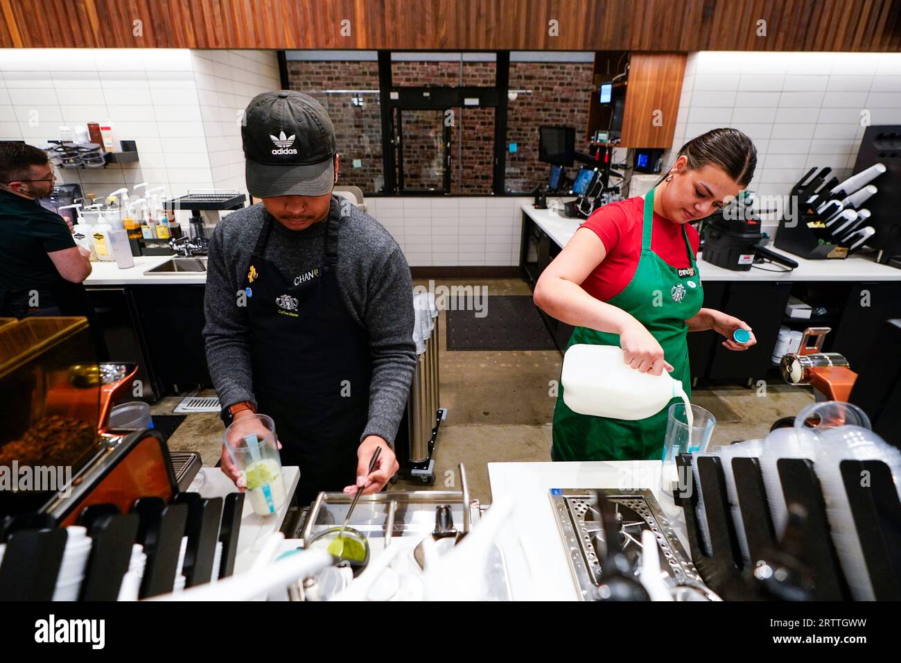 Tryer Lab partners Chan Chan and Emma Parnello, right, make drinks ...