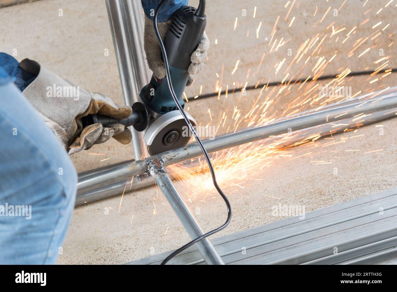 worker use grinding machine for grinding surface for steel pipe Stock ...