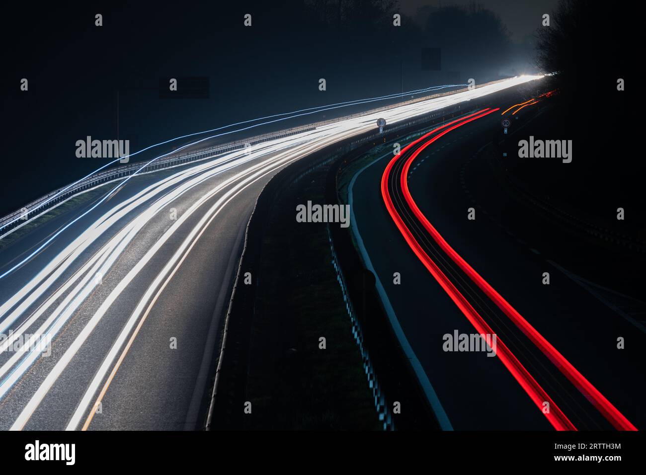 Abstract image of night traffic lights on the road. Car light trails at ...