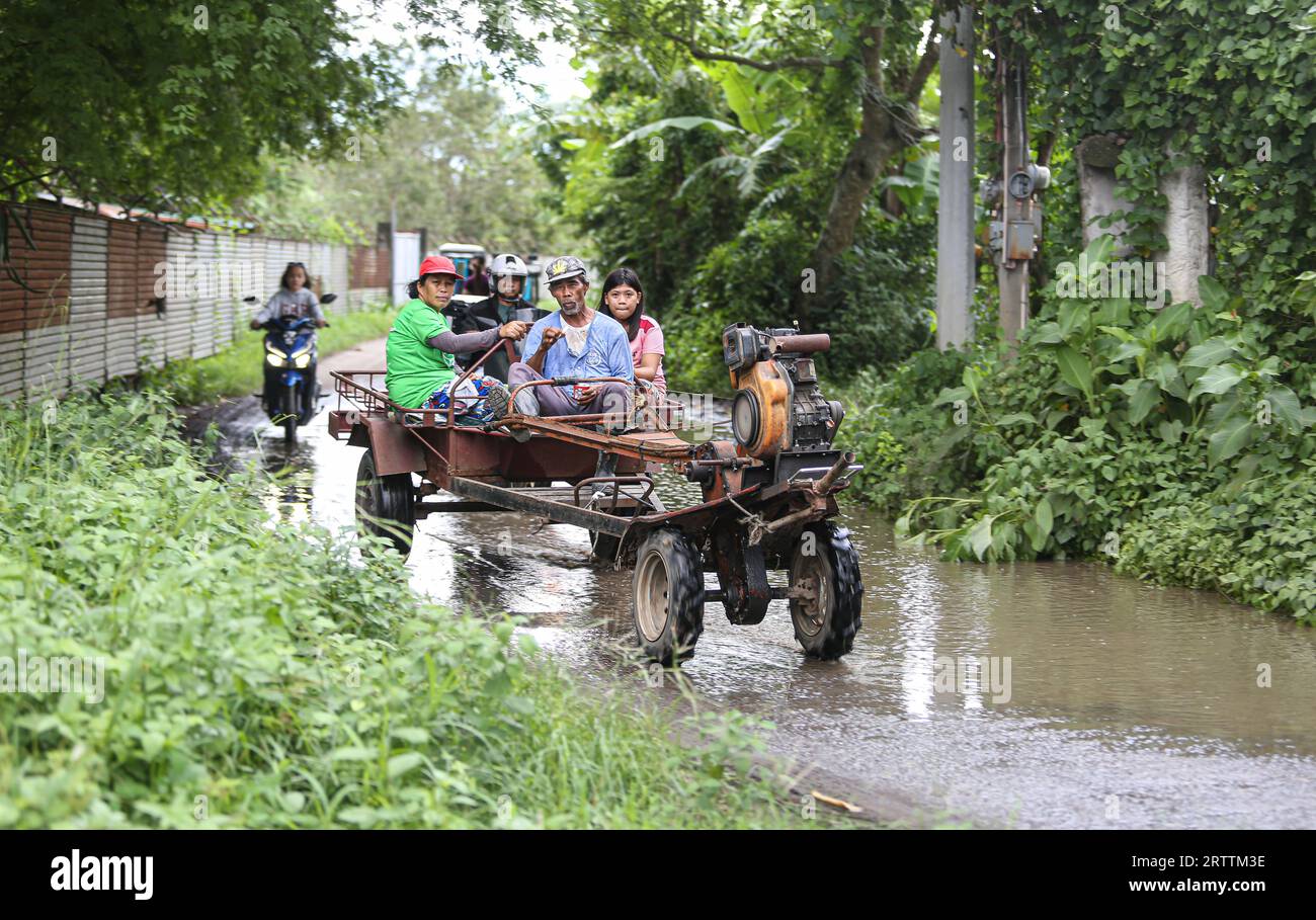 A Filipino man driving a Kuliglig, a local improvised vehicle on ...