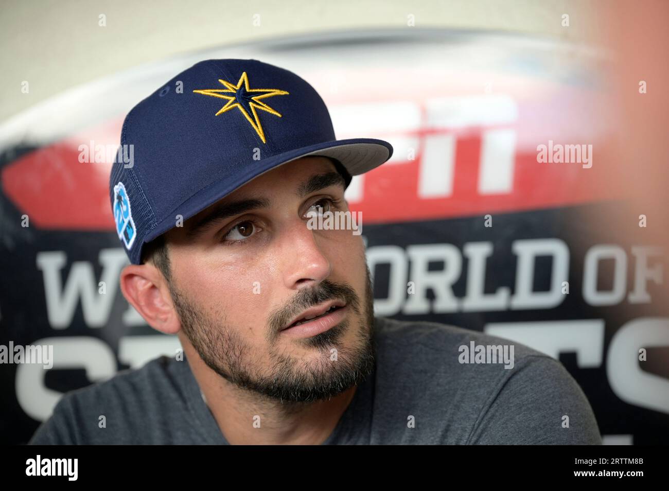 Tampa Bay Rays pitcher Zach Eflin talks with reporters in the dugout ...
