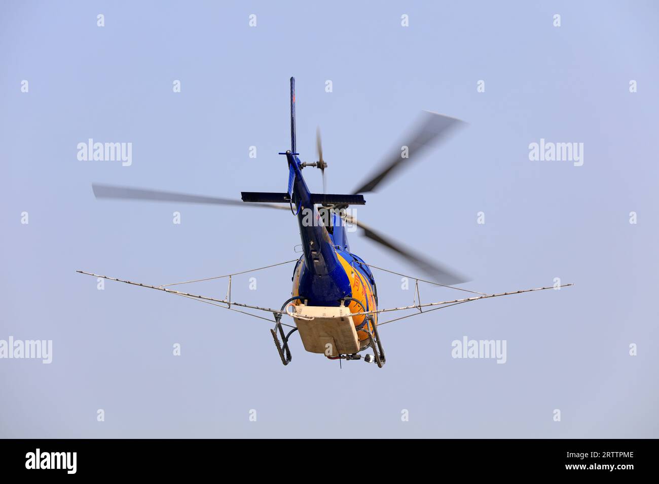 Agricultural helicopters fly in the air Stock Photo - Alamy