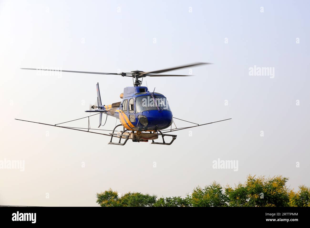 Agricultural helicopters fly in the air Stock Photo - Alamy