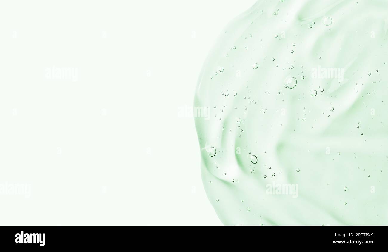 Serum gel smear on green background. Cosmetic transparent gel serum ...