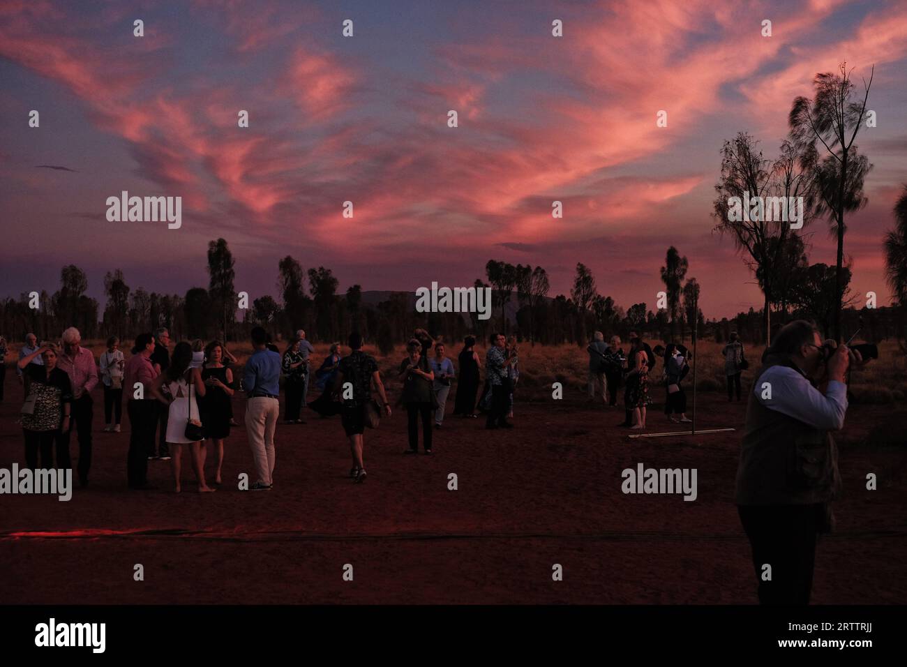 Opera lovers gather 'backstage' as pink cirrus clouds drift over Uluru ...