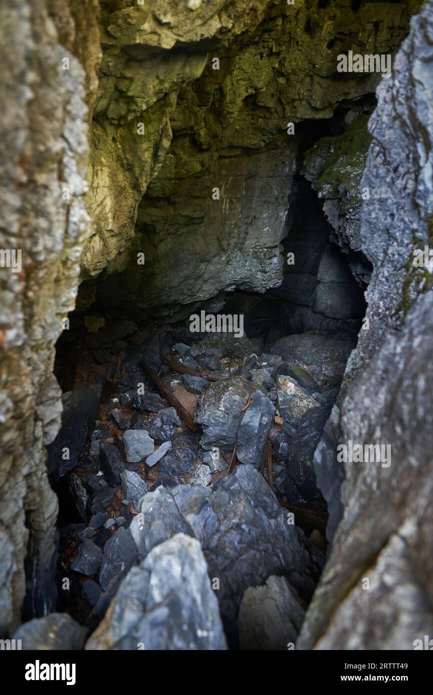 Dark cave formed in millions of years in the limestone mountains Stock ...