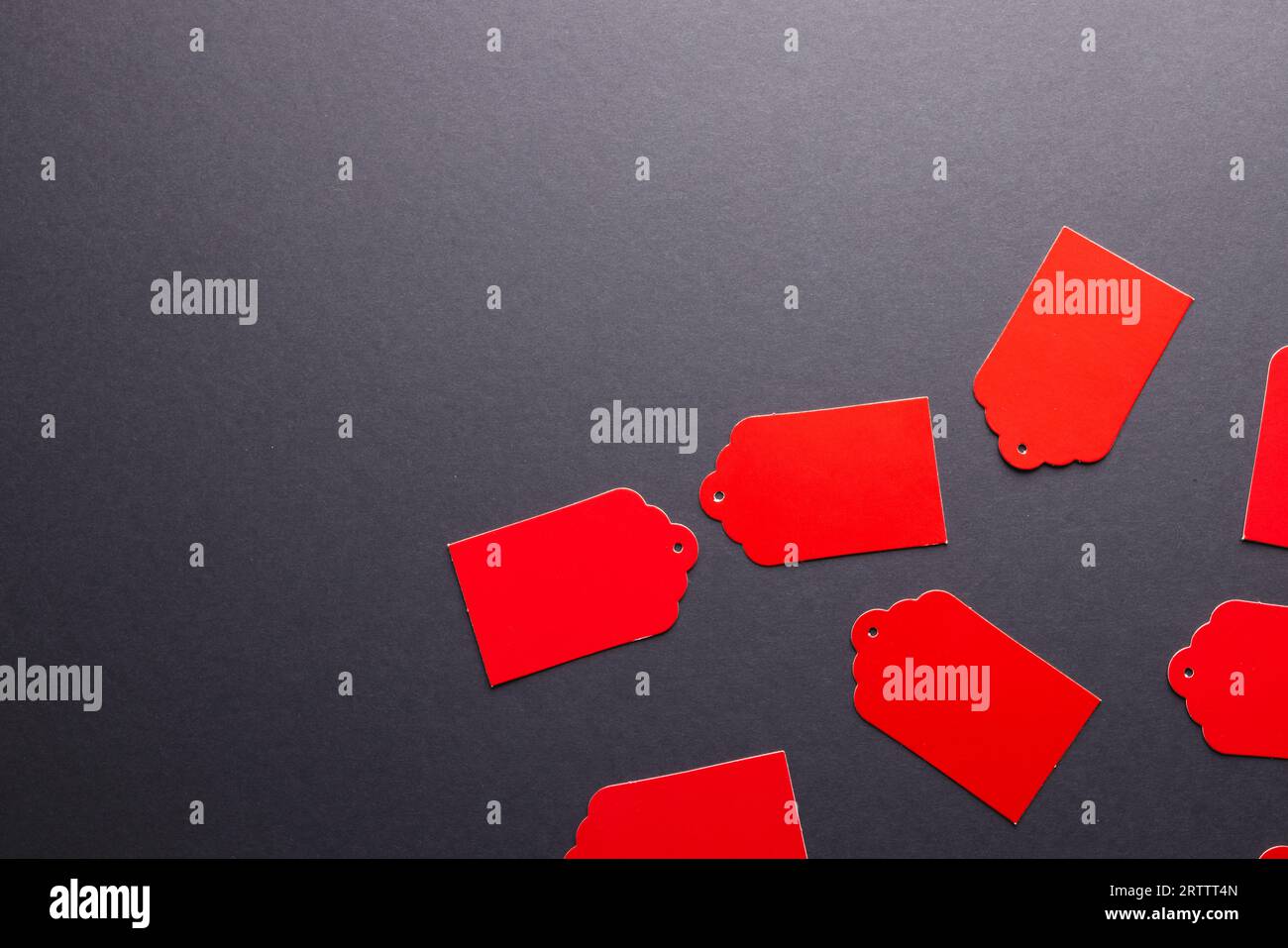 Red price tags with copy space on black background Stock Photo - Alamy
