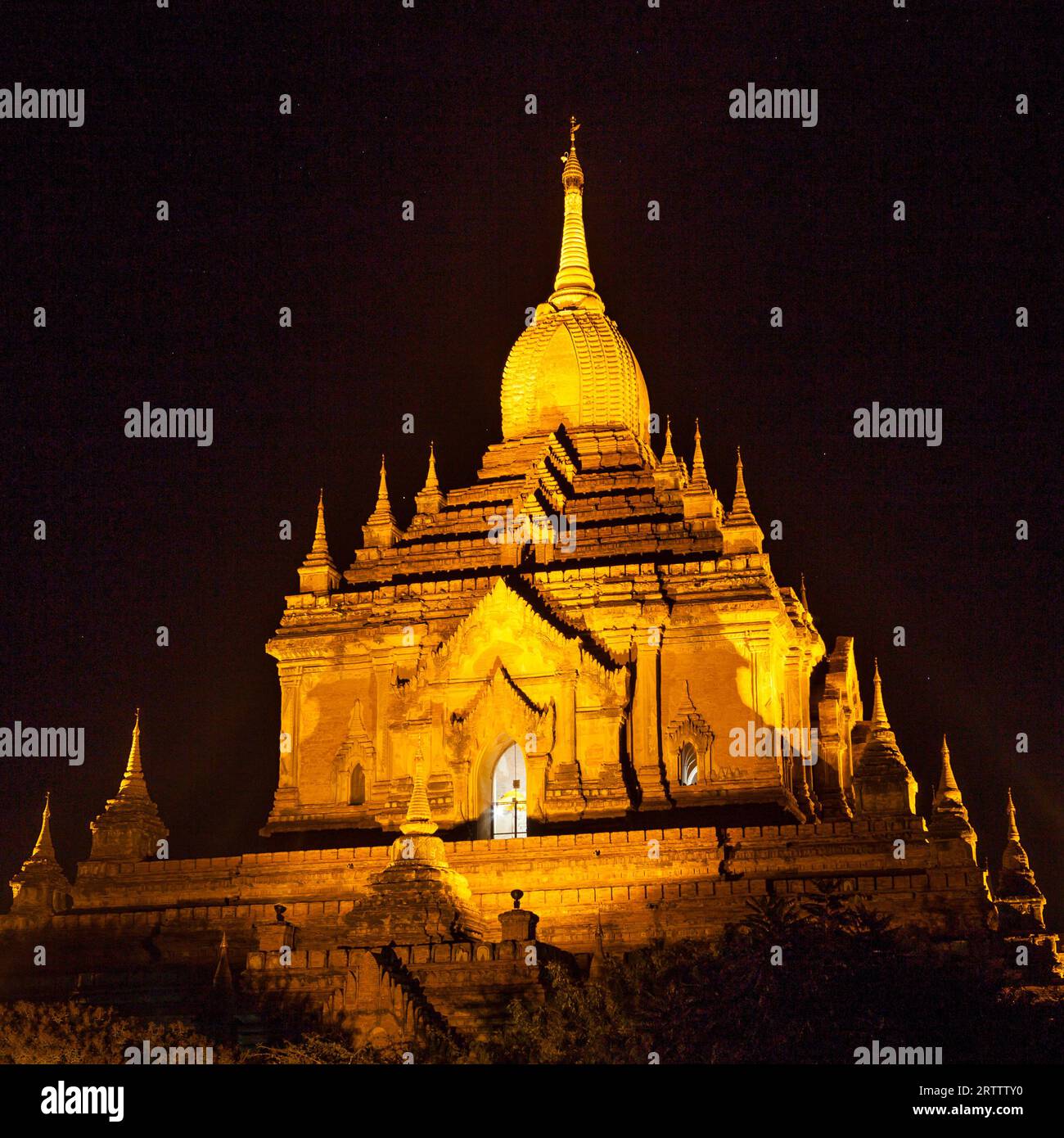 Bagan Temple in Myanmar at night illuminated. Buddhist pagoda in ...