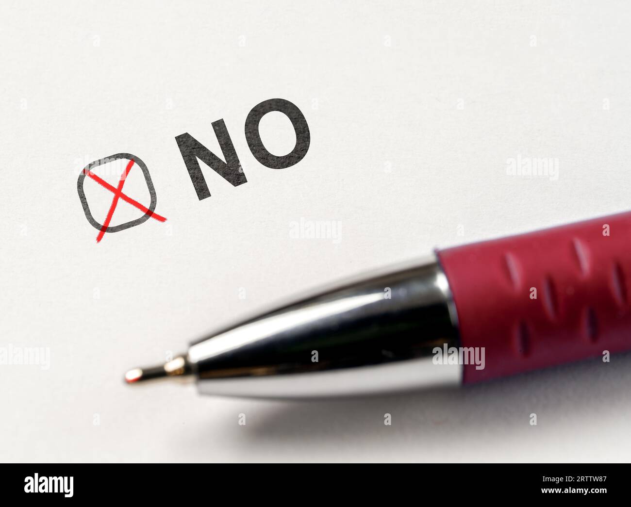 checkbox NO. marked with cross and red pen on white paper background ...