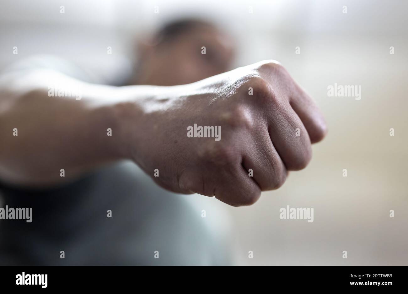 The angry man clenched his fist. Concept of violence Stock Photo - Alamy