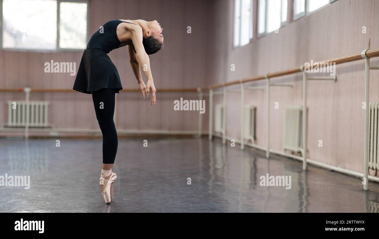 Asian woman dancing in ballet class. Bending in the back Stock Photo ...