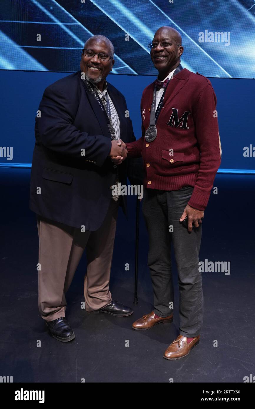Michael Carter (SMU), left, and Edwin Moses (Morehouse) pose during the ...