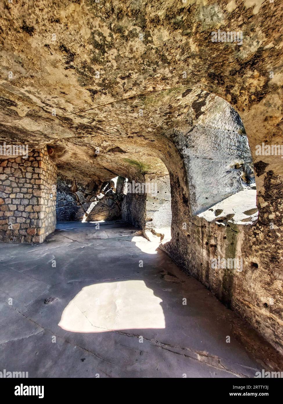 Sunlight falling into underground vault made of rocks Stock Photo - Alamy