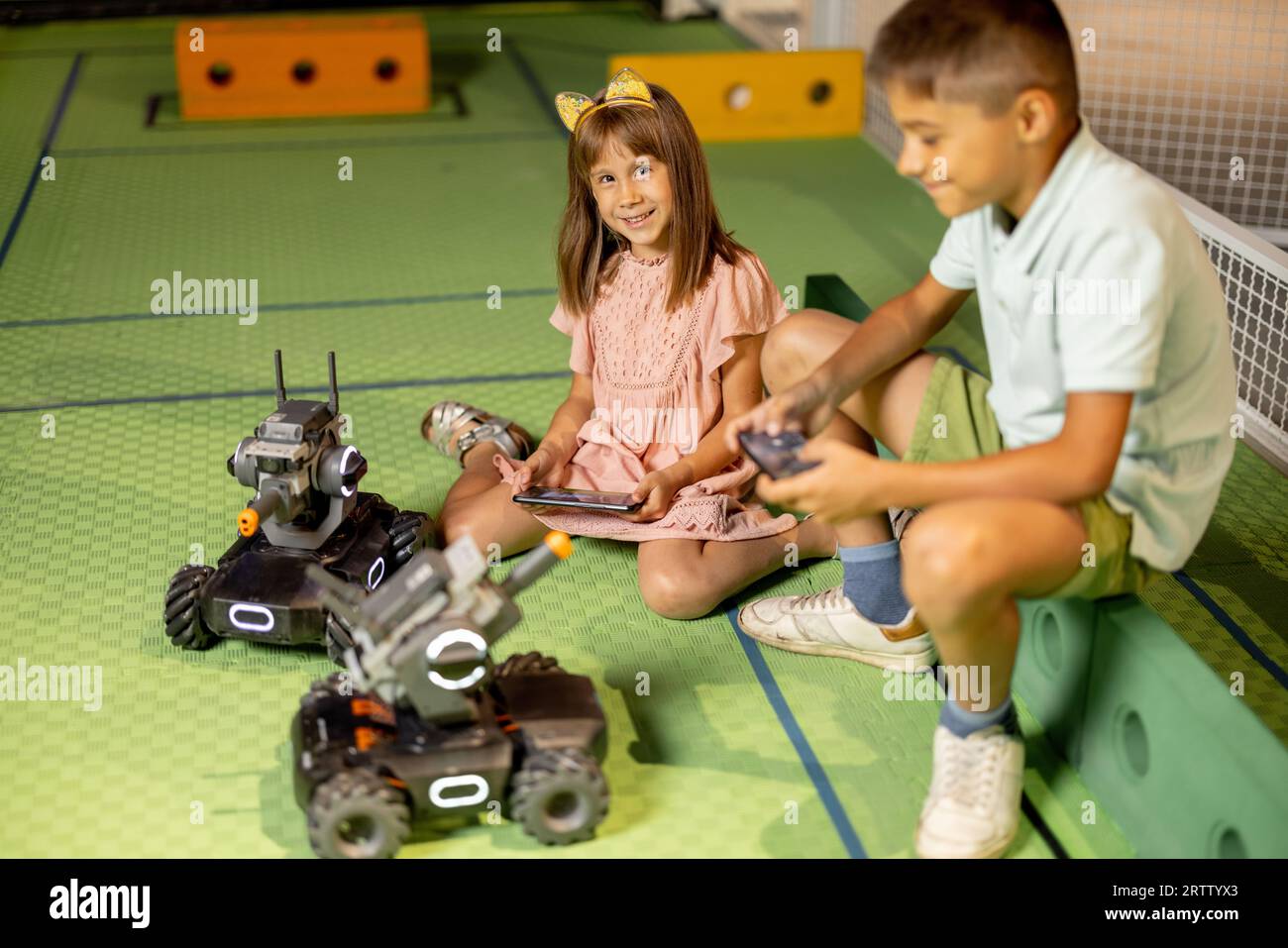 Kids playing with robotic cars Stock Photo - Alamy