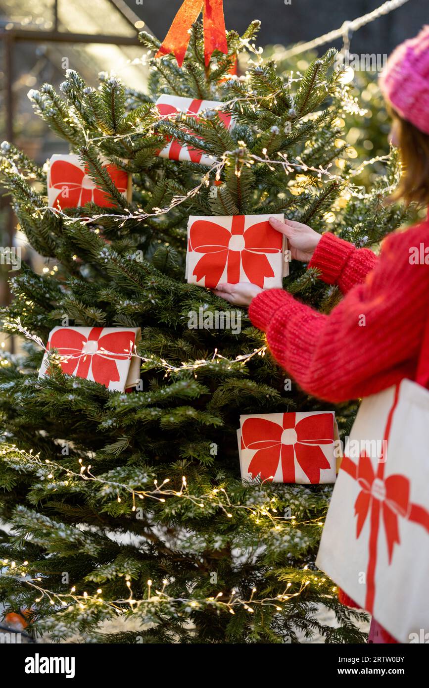 Decorates Christmas tree with big red bows Stock Photo - Alamy