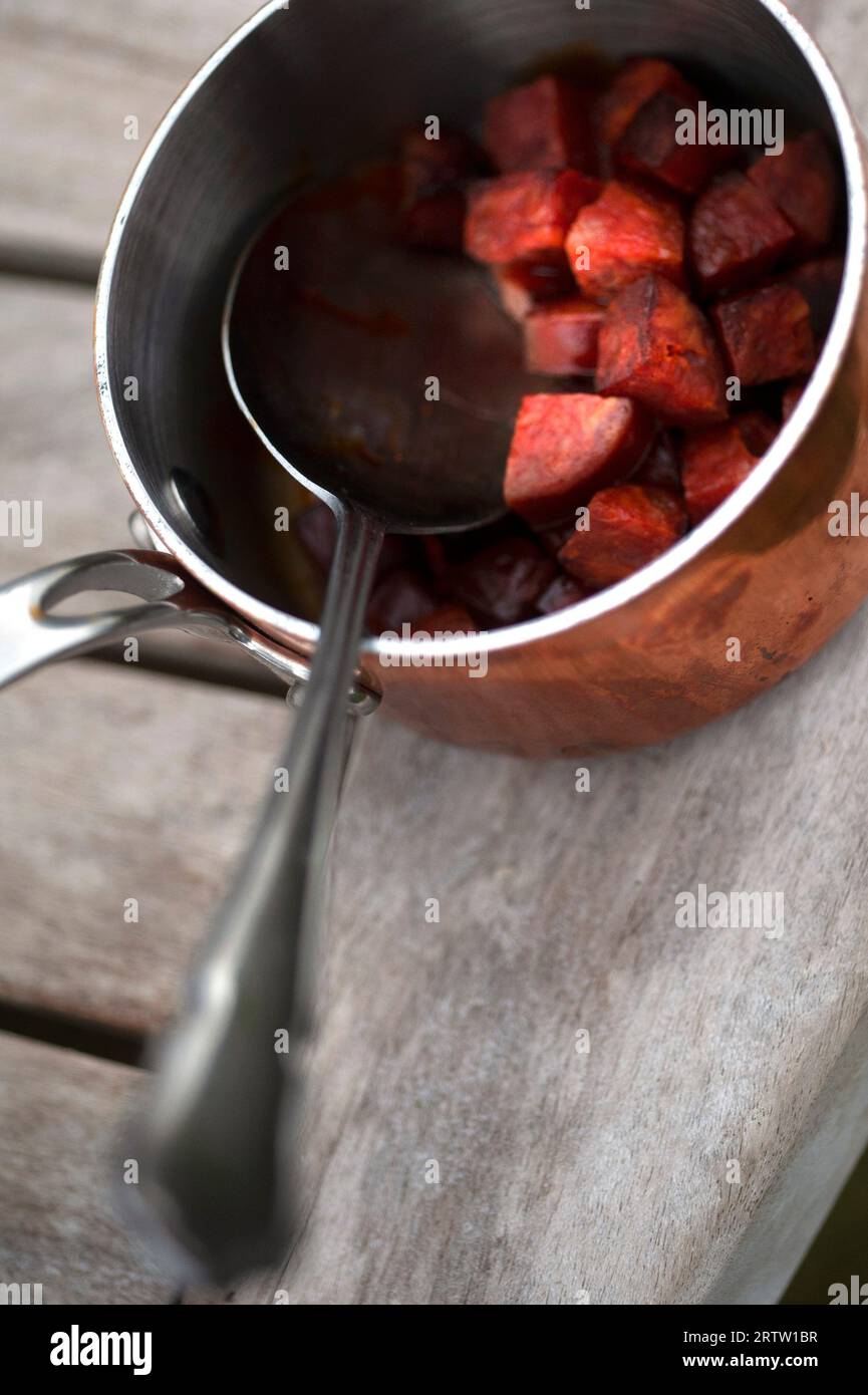 Red roasted potatoes in a copper pan Stock Photo - Alamy