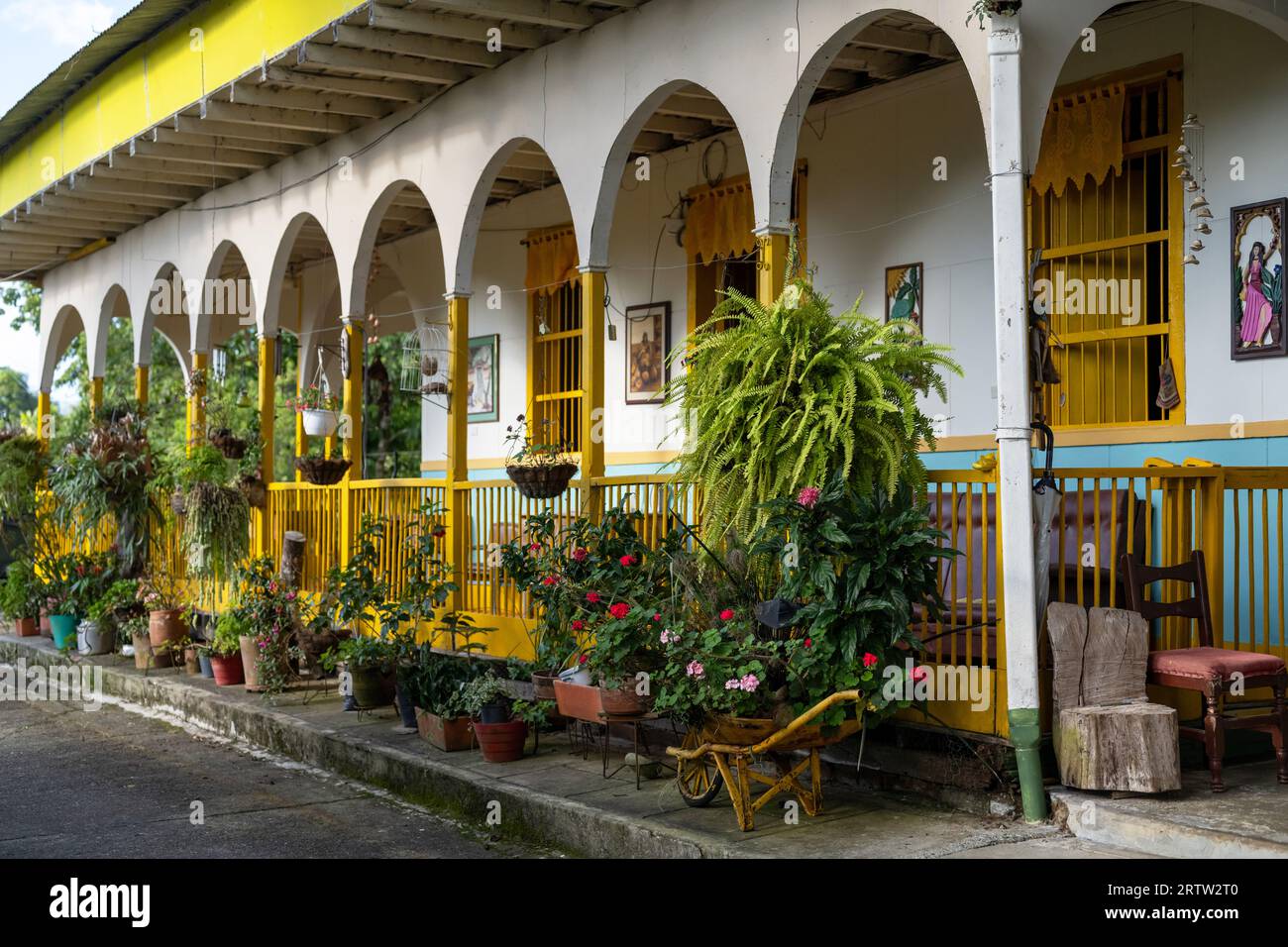 July 9, 2023: Vivid exterior of traditional Colombian farm with pots ...