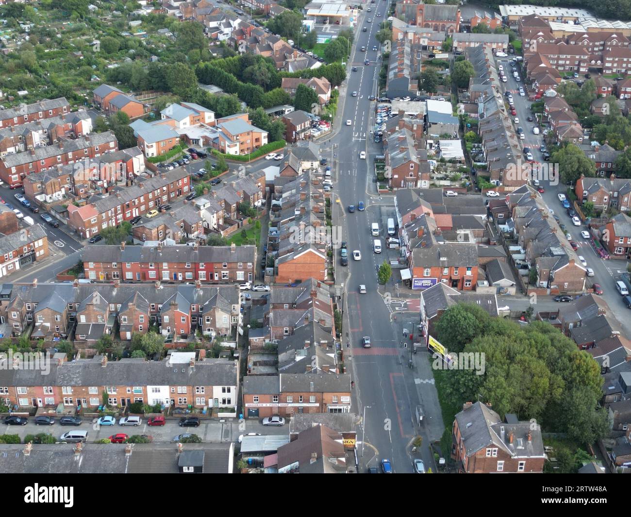 An aerial view of a bustling city street with low-rise buildings ...