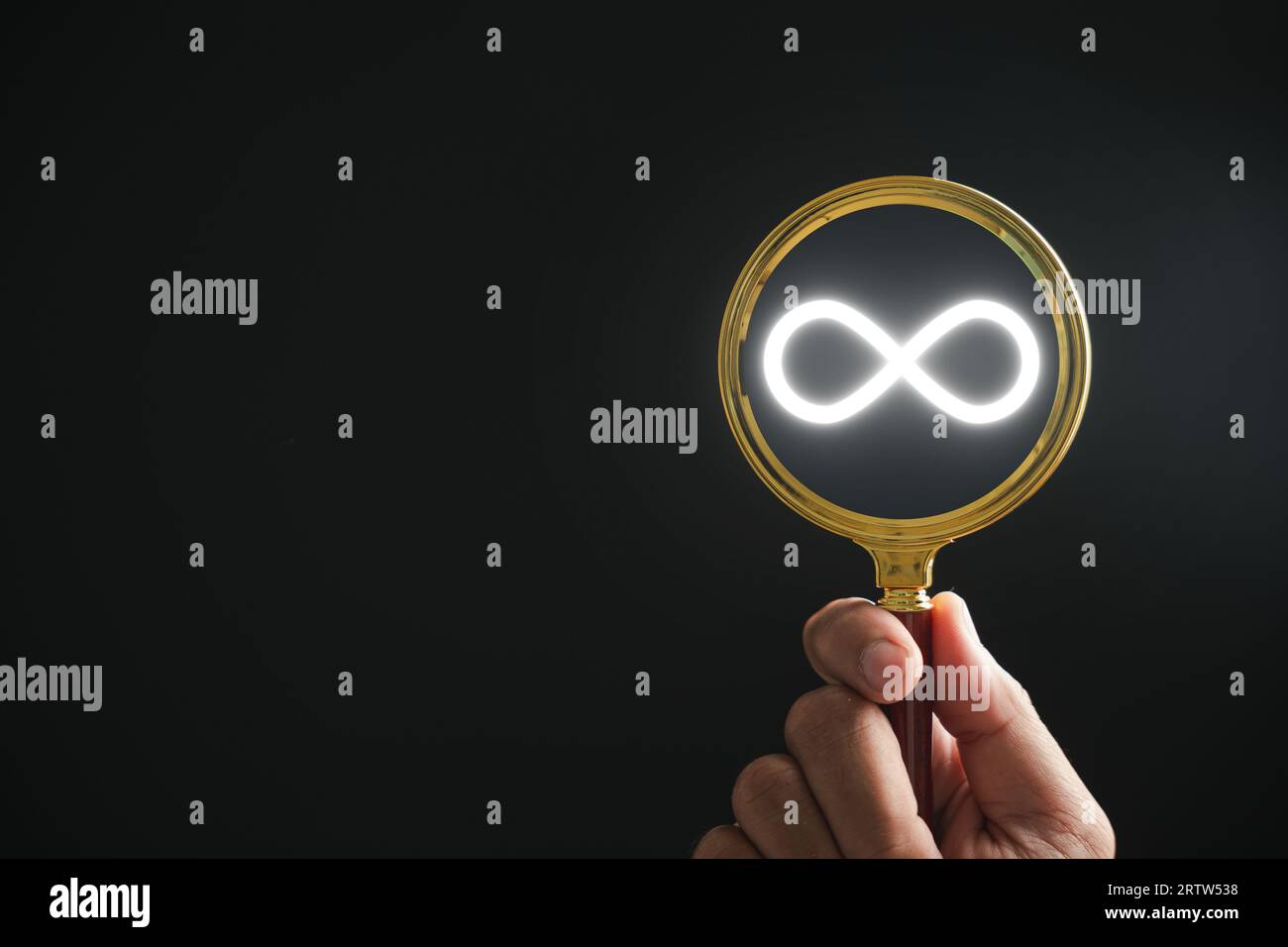 Magnifying glass highlights infinity symbol icons Stock Photo - Alamy Magnifying glass highlights infinity symbol icons Stock Photo - Alamy