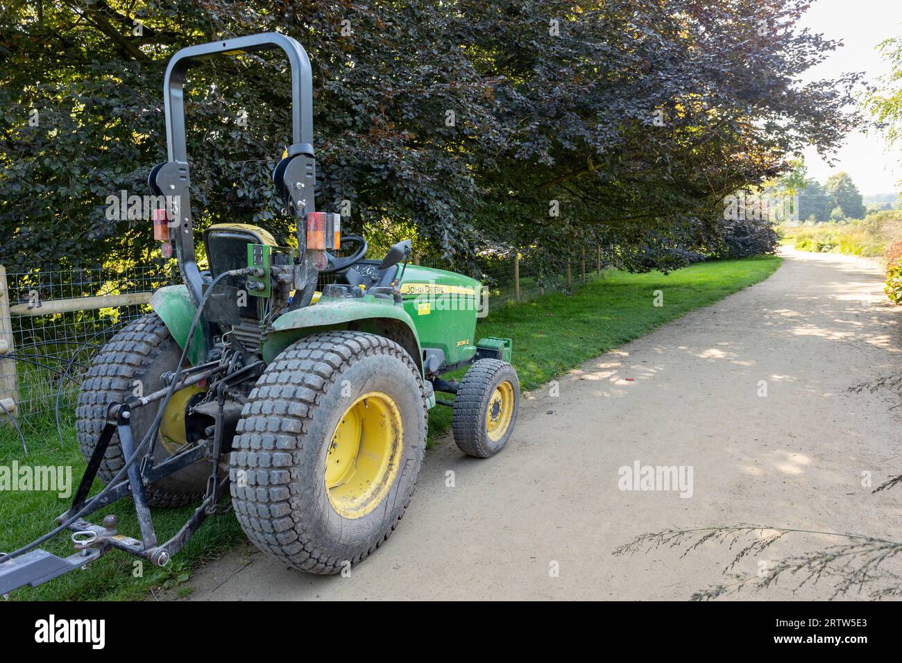 Green tractor on a public road hi-res stock photography and images - Alamy
