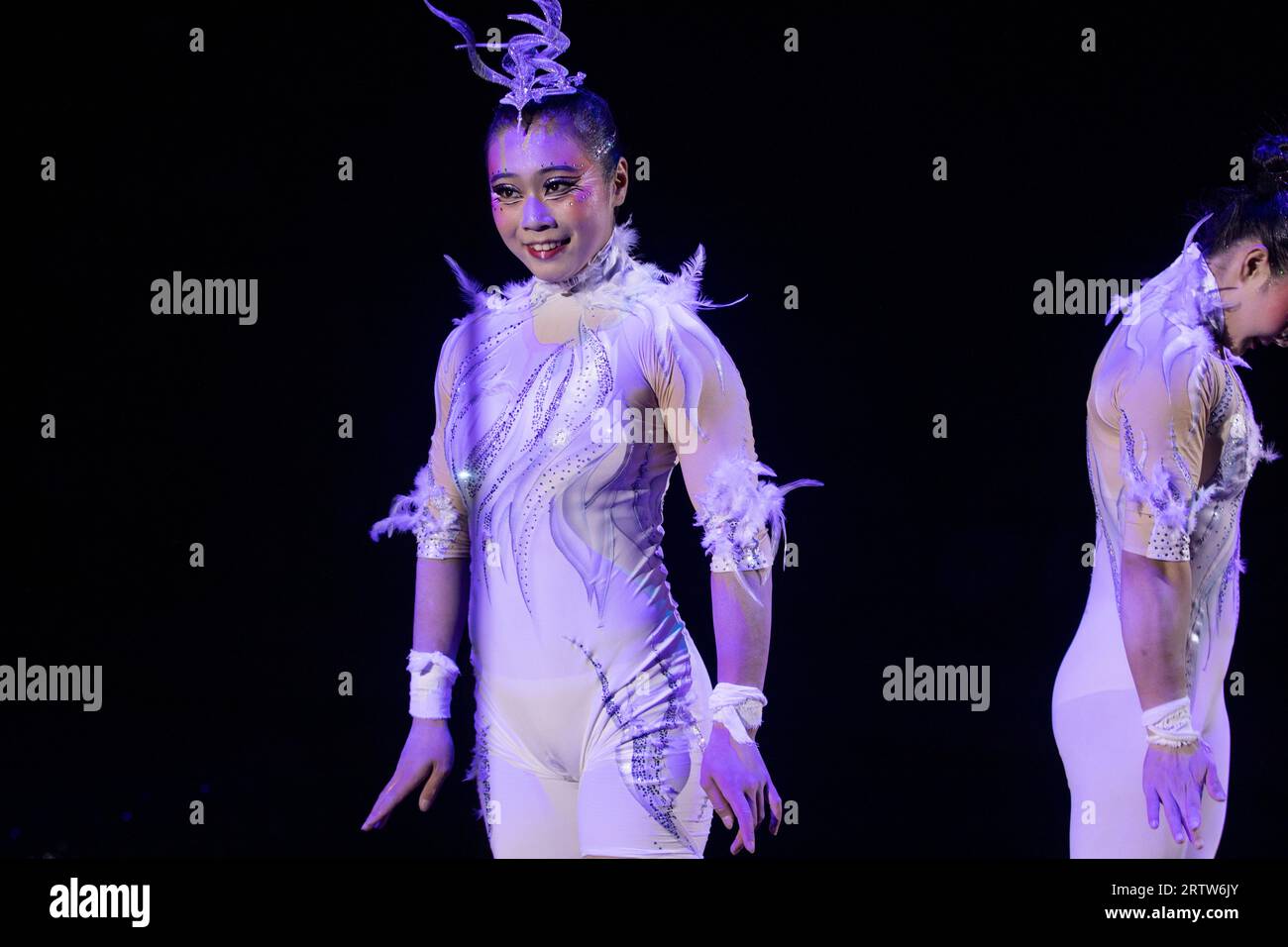 Aerial trapeze circus artists from China Liu Xinqi and Xu Yangqian ...